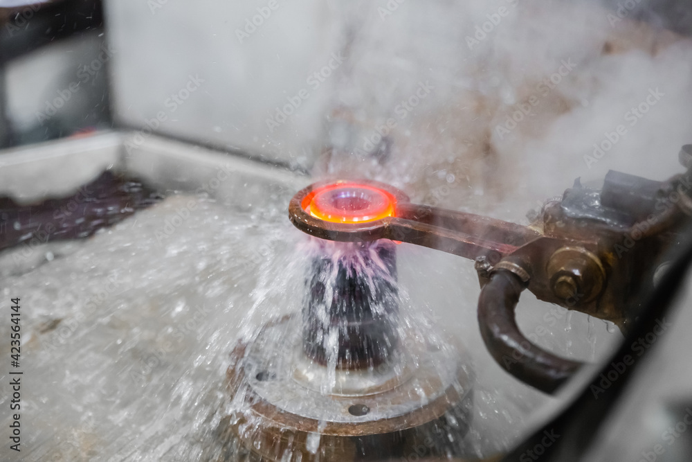 The process of heating and cooling a metal part. Stock Photo | Adobe Stock