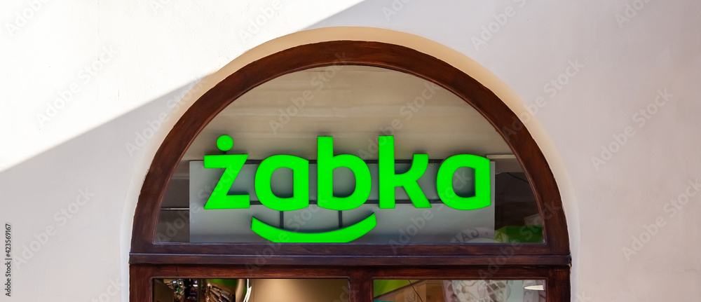 Żabka store front company logo symbol front view, shop facade up close ...
