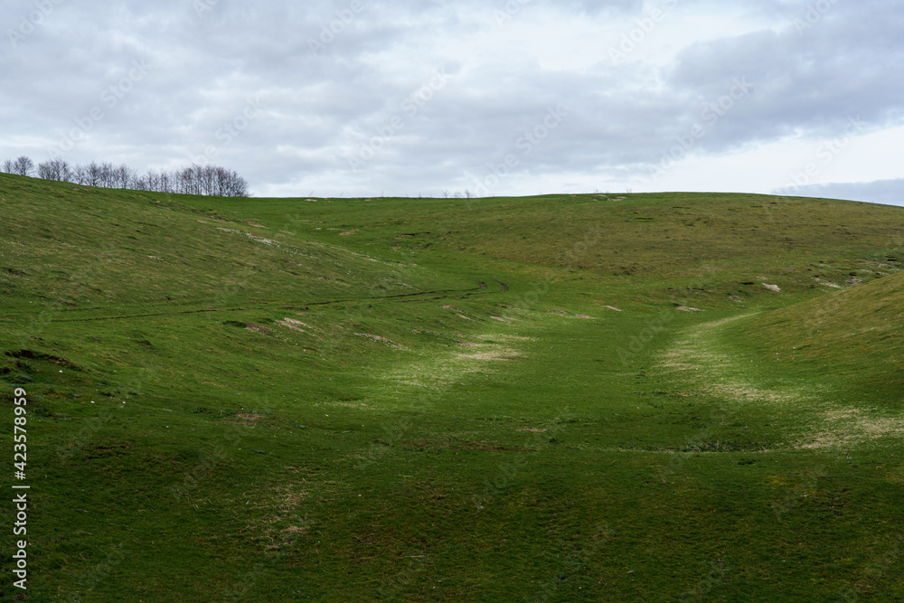 view up a rabbit warren strewn valley on the up-faulted Southern edge ...