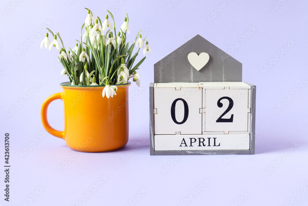 Calendar for April 2: cubes with the numbers 0 and 2, the name of the ...