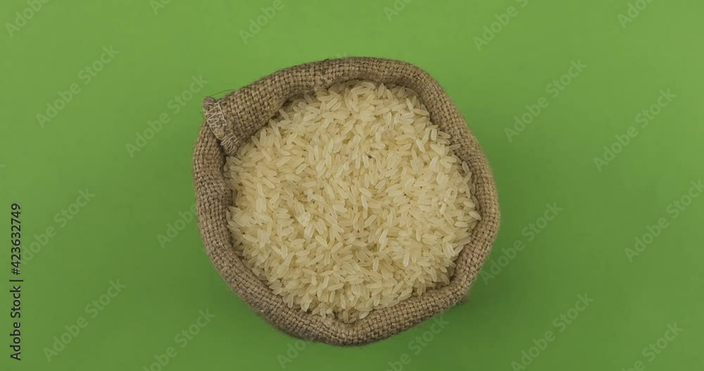 Rotation of a full sack of rice grain. Top view. Isolated vídeo de ...