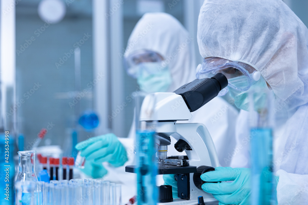 Close up Asian man scientist is wearing Personal Protective Equipment ...