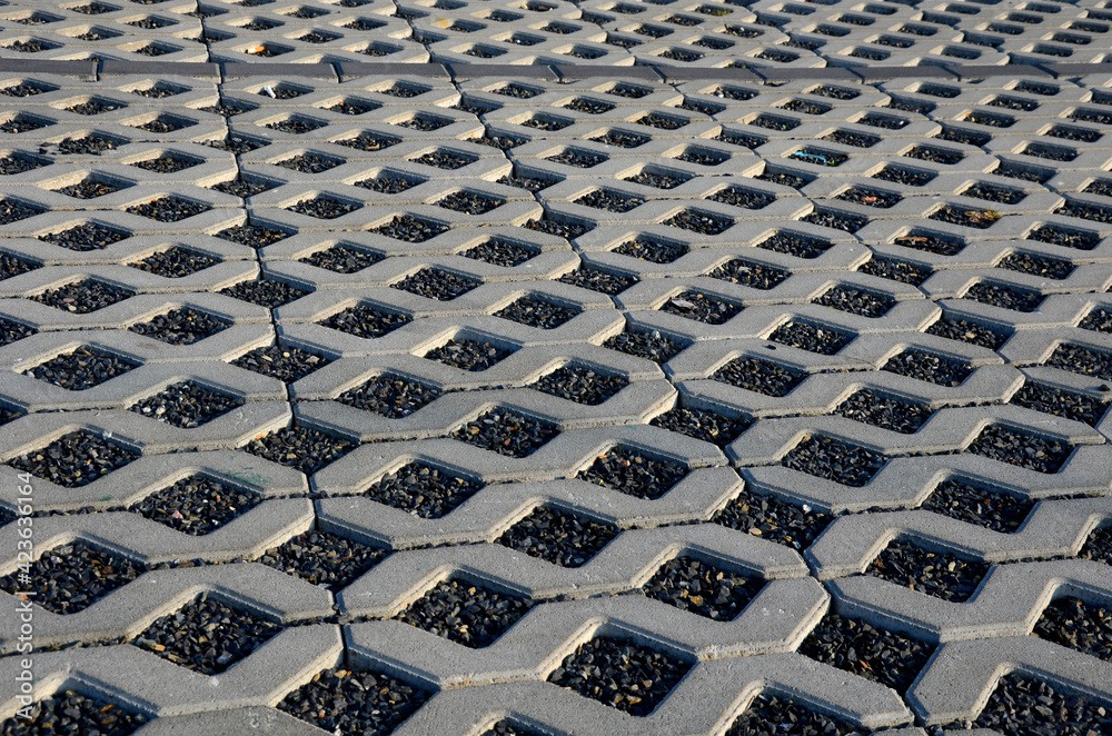 new infiltration parking lot made of porous concrete tiles in a regular ...