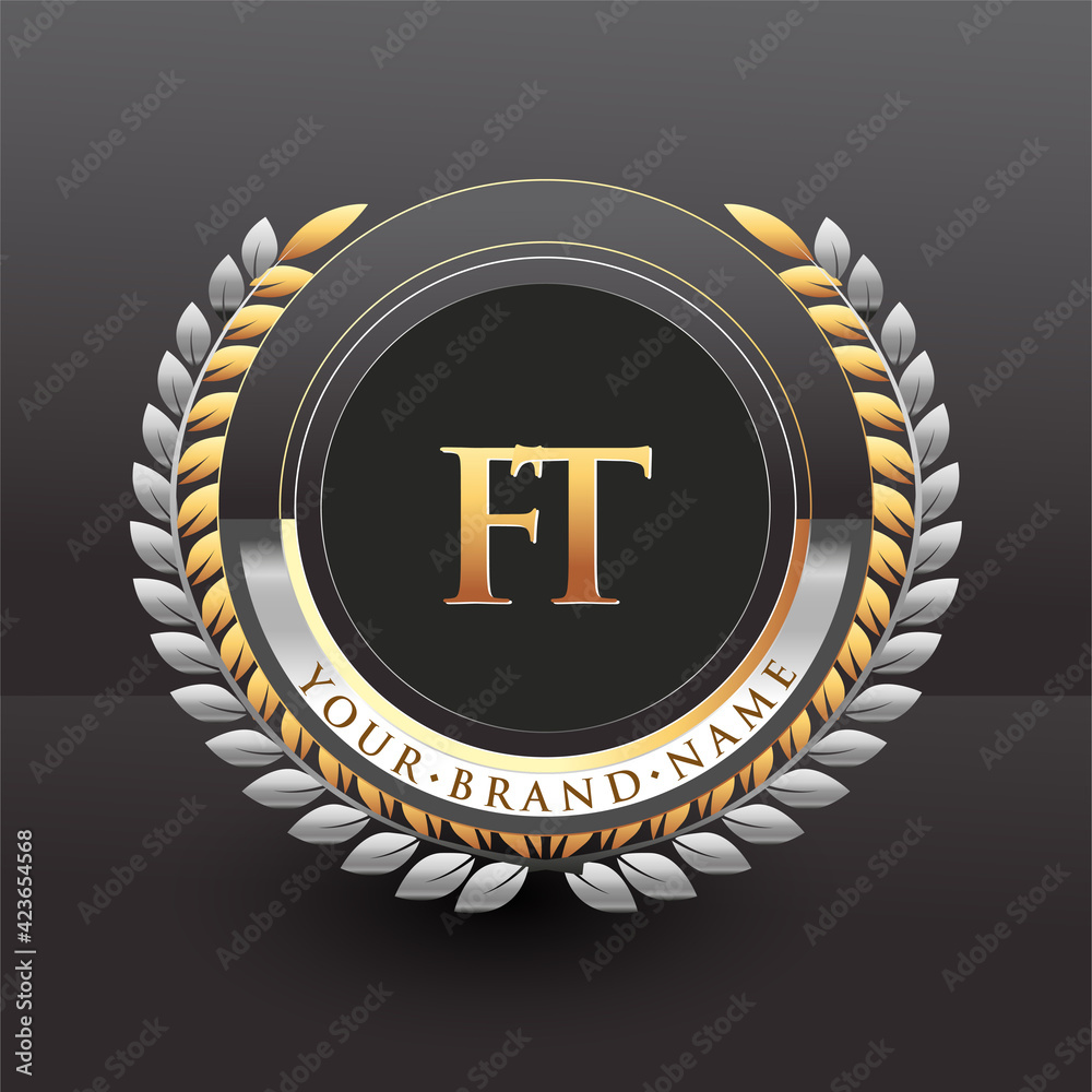 Initial logo letter FT with golden and silver color with laurel and ...
