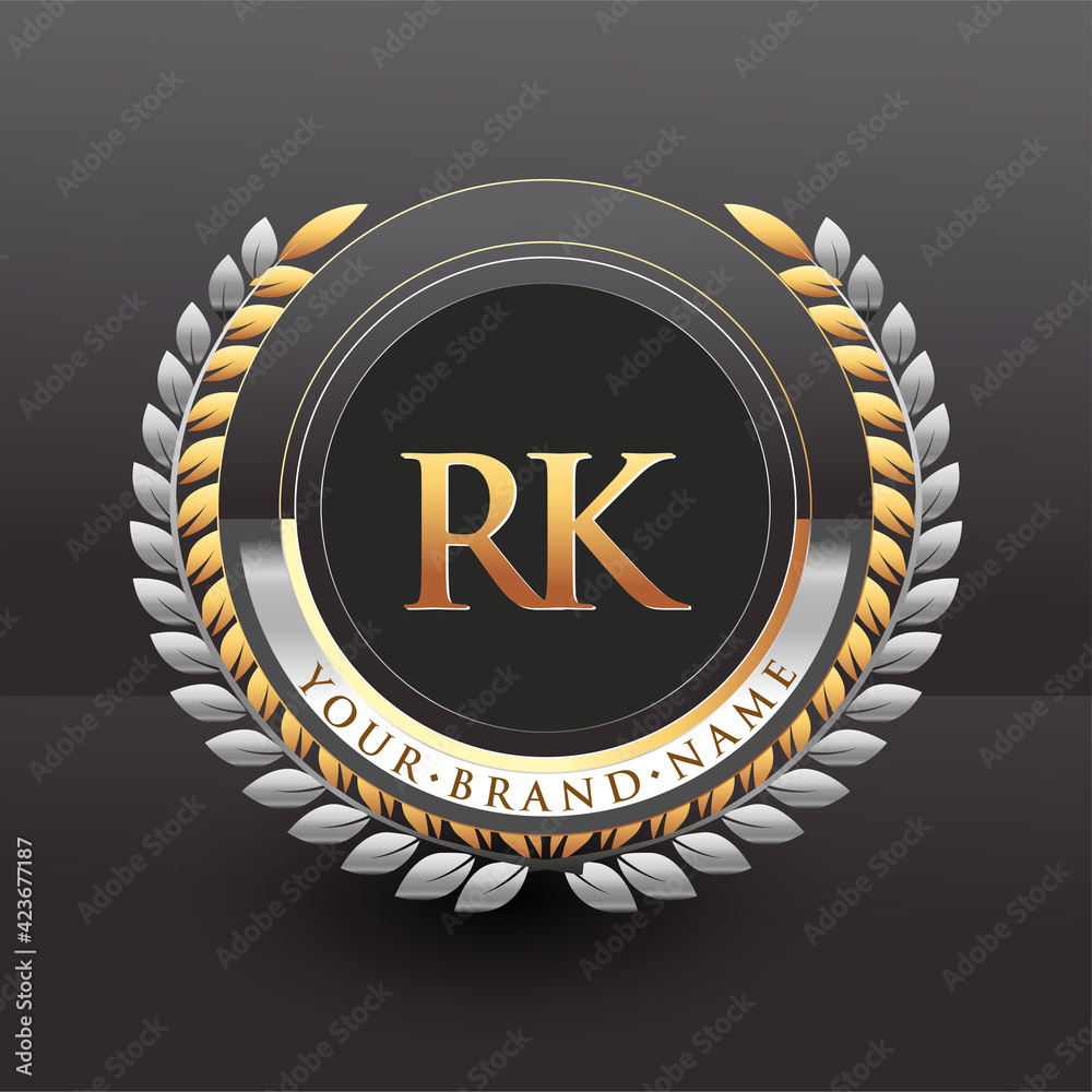 Initial logo letter RK with golden and silver color with laurel and ...