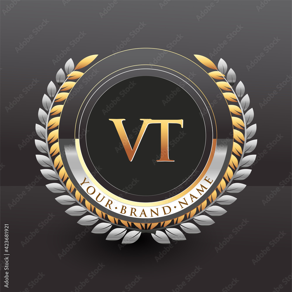 Initial logo letter VT with golden and silver color with laurel and ...