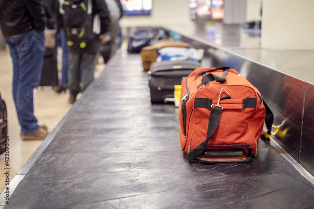 Baggage claim luggage conveyor belt at airport Stock Photo | Adobe Stock