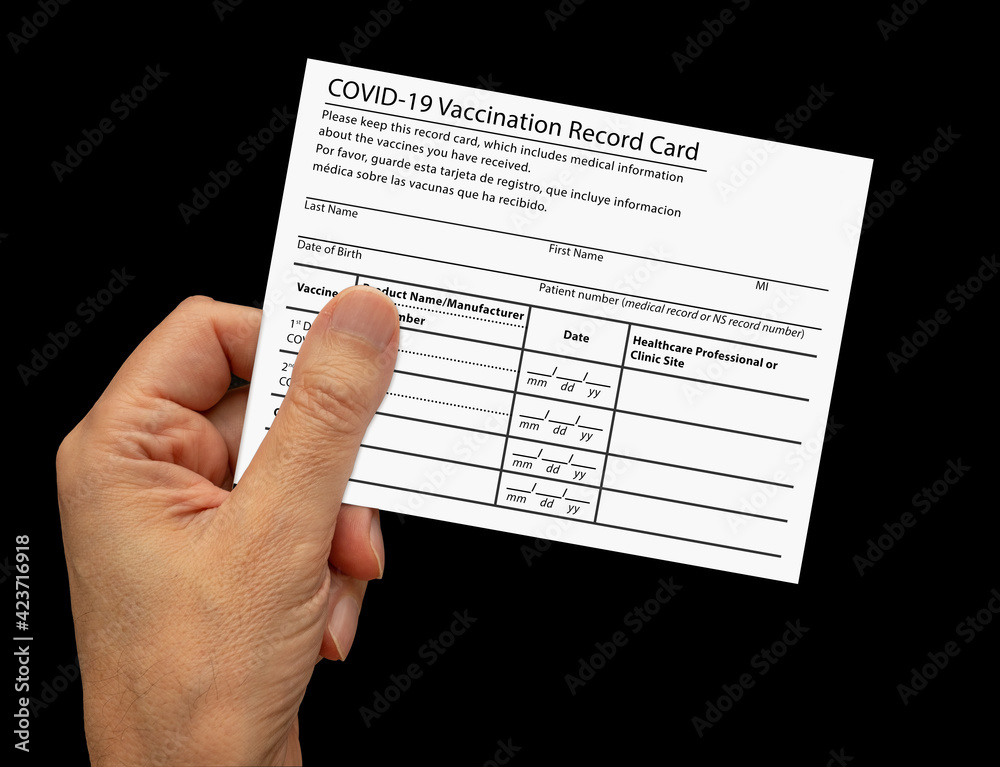 Blank COVID-19 Vaccination Record card with hand on black background ...