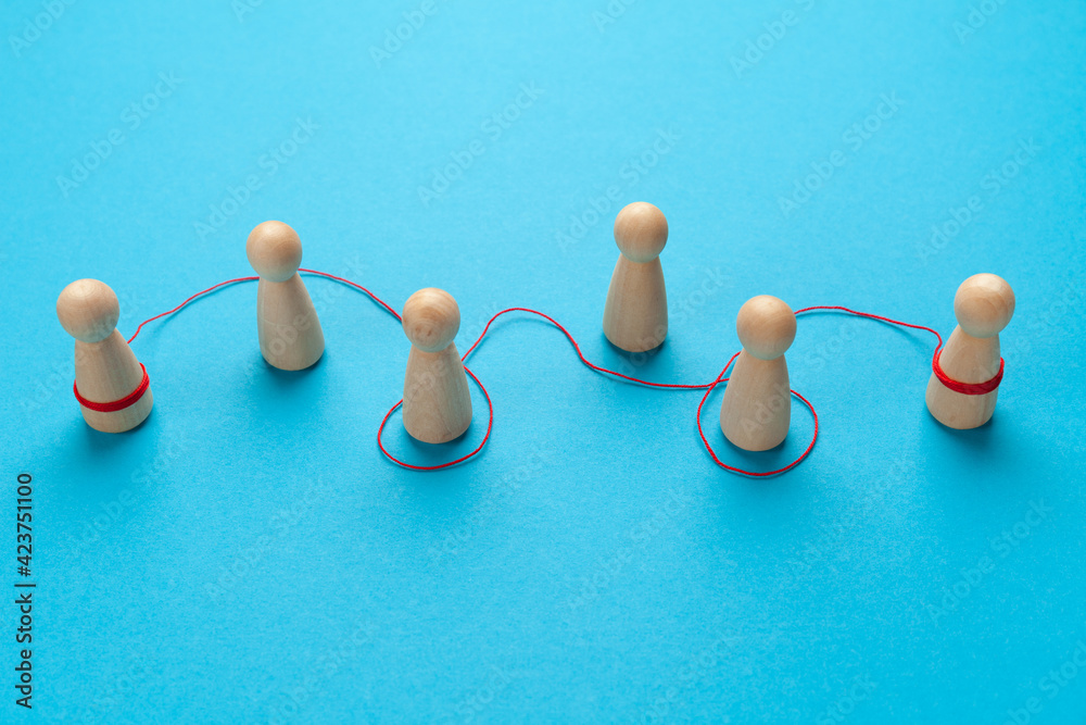 Word of mouth. The figures of people are connected with a thread ...