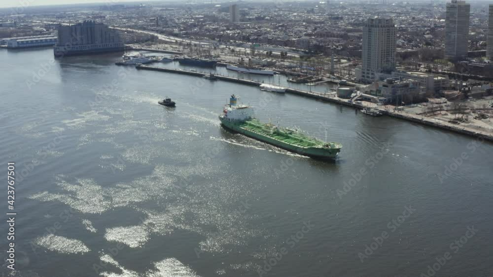 Cargo Boat on the Delaware River under the Benjamin Franklin Bridge ...