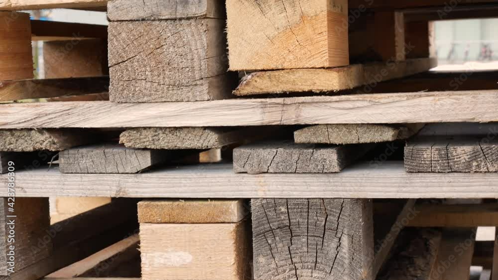 Wooden transport pallets stacked, slow tilt up, pallet pile, simple ...