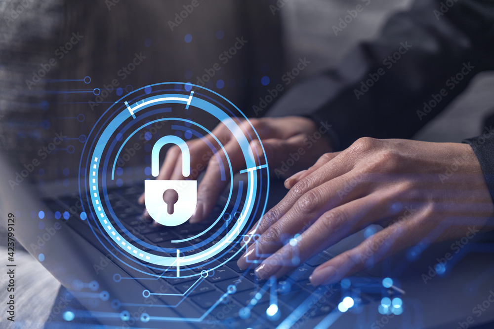 A woman programmer is typing a code on computer to protect a cyber ...