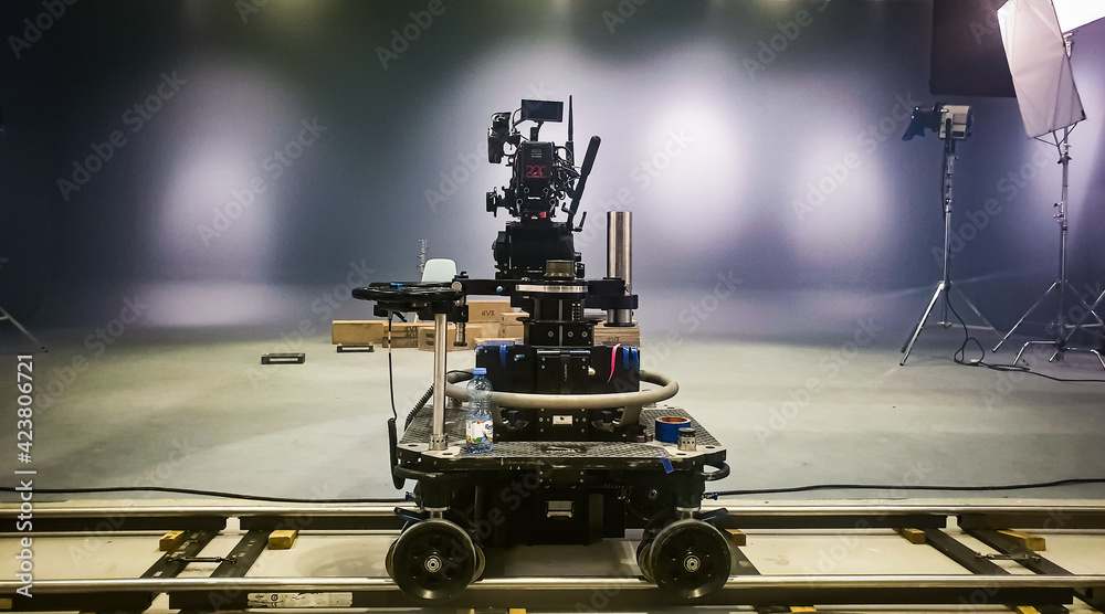 Camera on a dolly track in a film studio Stock-Foto | Adobe Stock