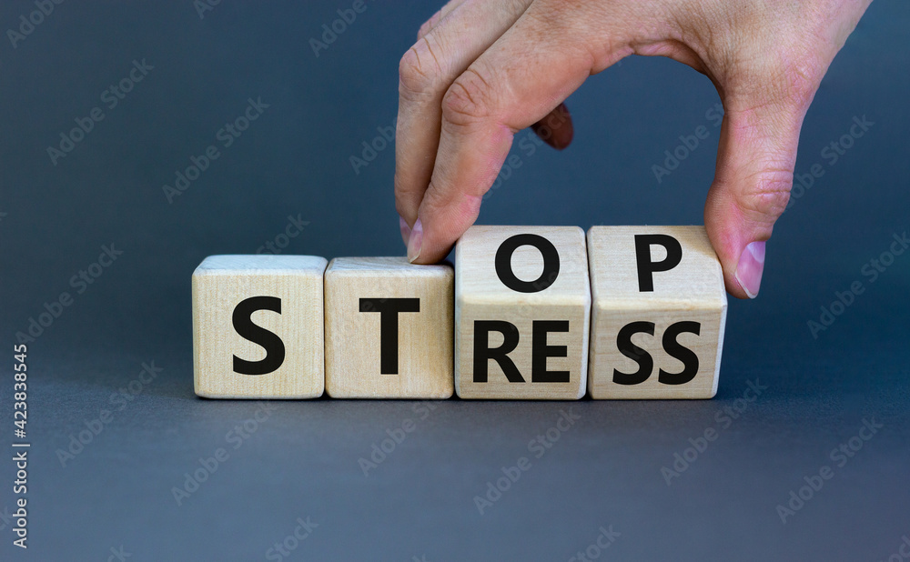 Stop stress and be health symbol. Doctor turns cubes and changes words ...