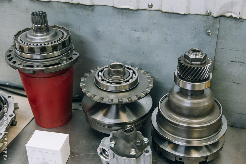 Set of various engine and gearbox spare parts. Shiny gears for ...