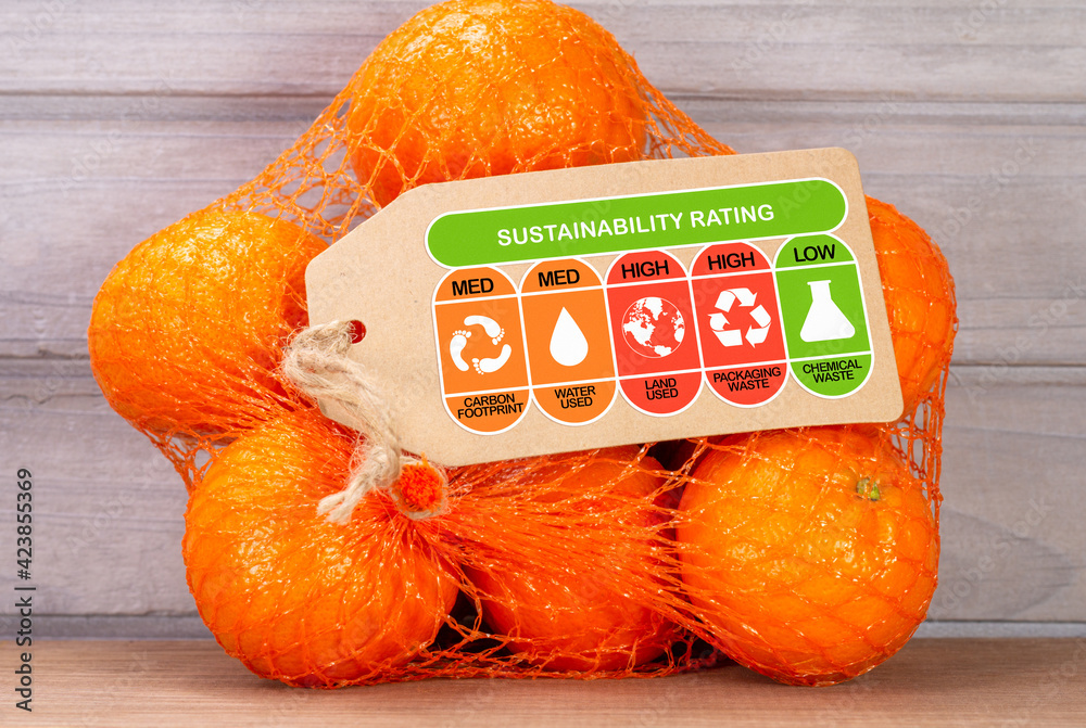 Consumer environmental sustainability rating label on bag of oranges ...
