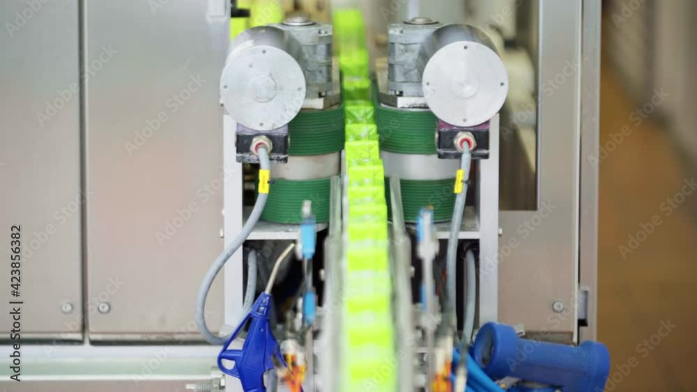 Production Facility. Small Green Packets with the Straw attached are ...