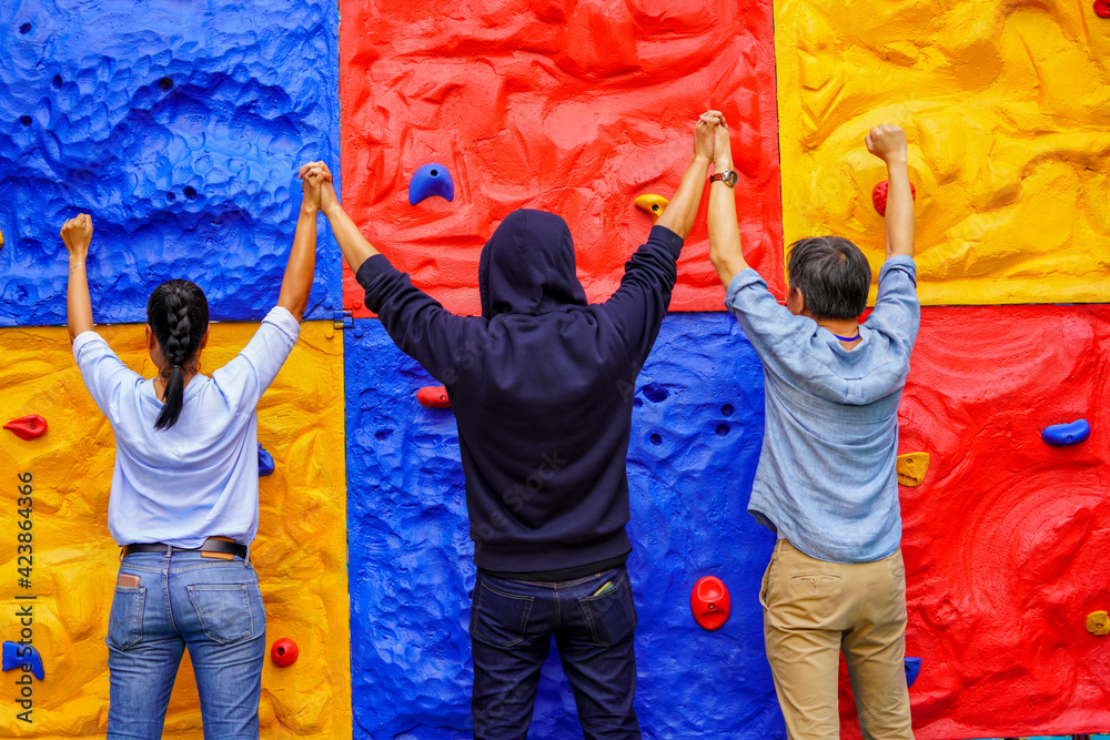 Three people holding hands rise up. Unity concept. friend hold hands up ...