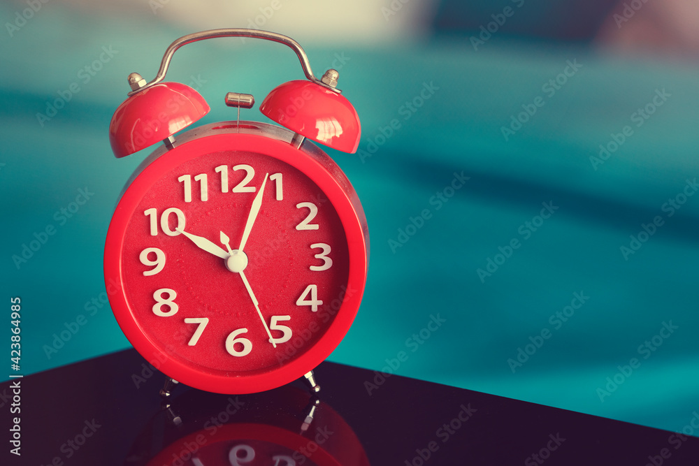 Closeup on clockwise. Face of red Alarm clock at 10 O'clock Stock Photo ...