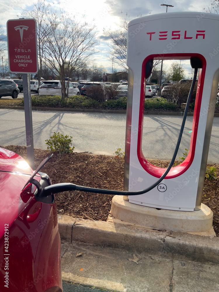 Tesla Version 3 Supercharger Charging Red Tesla Model 3 Stock Photo ...