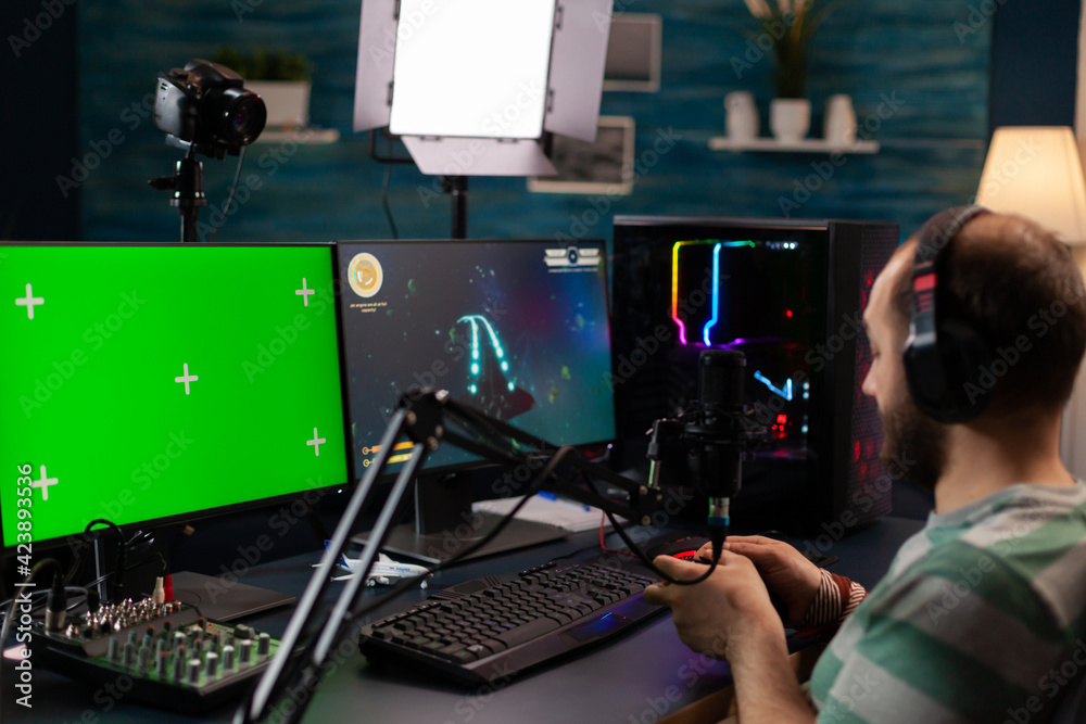 Professional cyber streamer playing digital videogames on professional ...