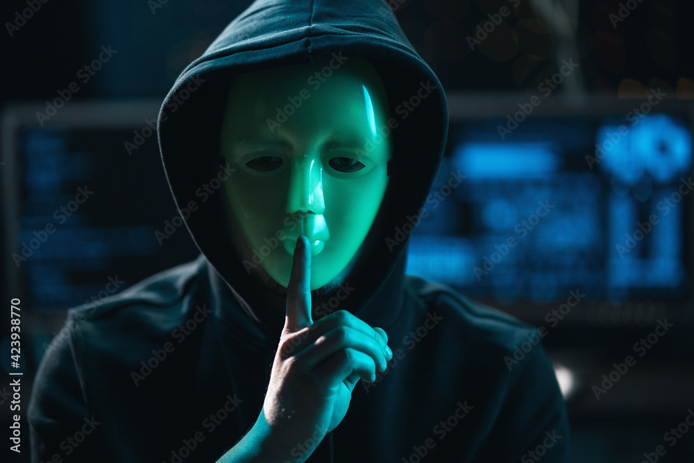 Dangerous Internationally Wanted Hacker with Masked Face Speaks into ...
