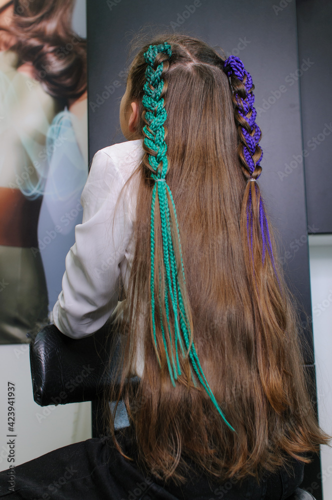 Back view of a teenage girl with dark long hair and a hairstyle from ...
