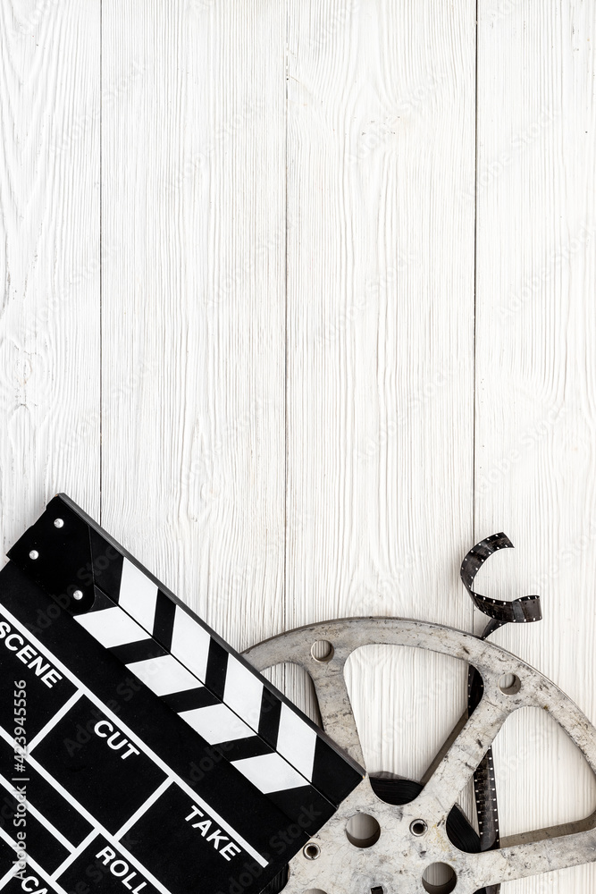 Motion picture film reel with movie clapper. Cinema concept Stock Photo ...