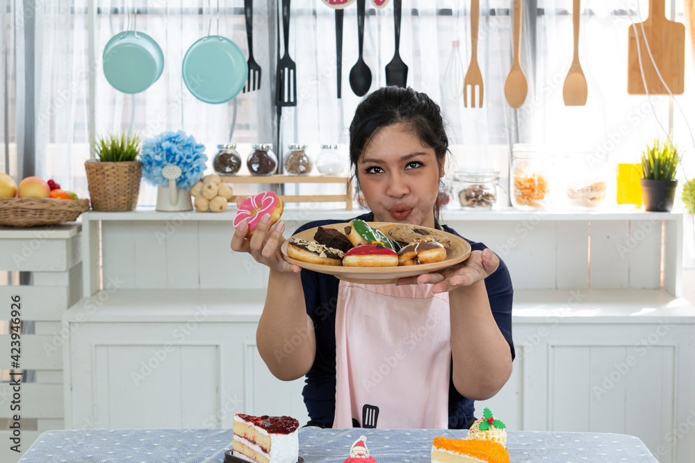 Fotografia do Stock: Happy obese young woman with plates full of sweet ...