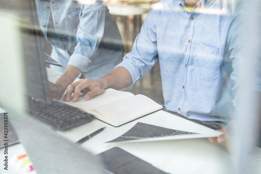 Programming developing software application. programmer writing program code with two monitors ...