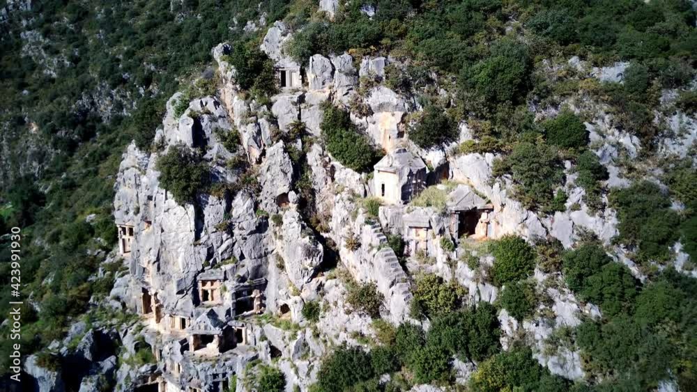 High angle drone aerial view of ancient greek rock cut lykian empire ...