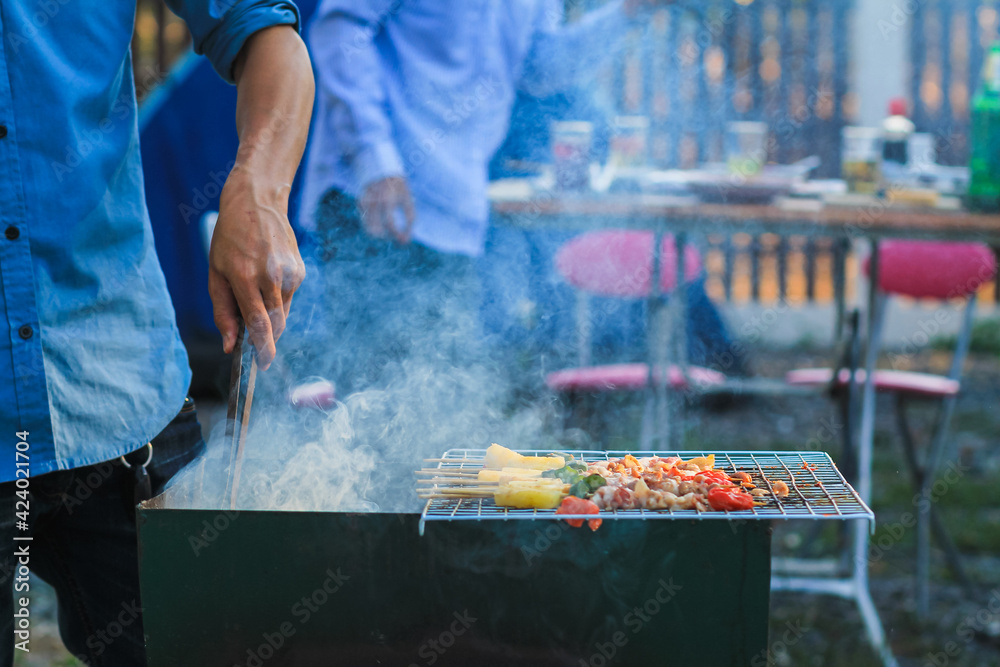 Blurred images , A group of colleagues held a barbecue party. (BBQ ...