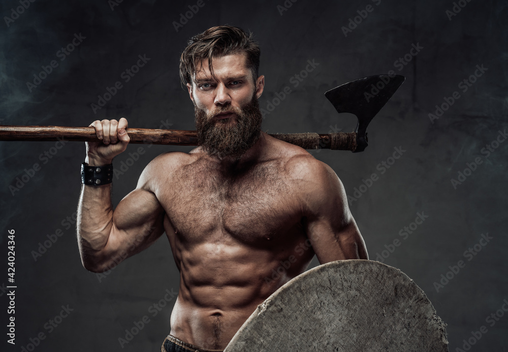 Muscular viking with axe and shield in dark smoke background Stock ...