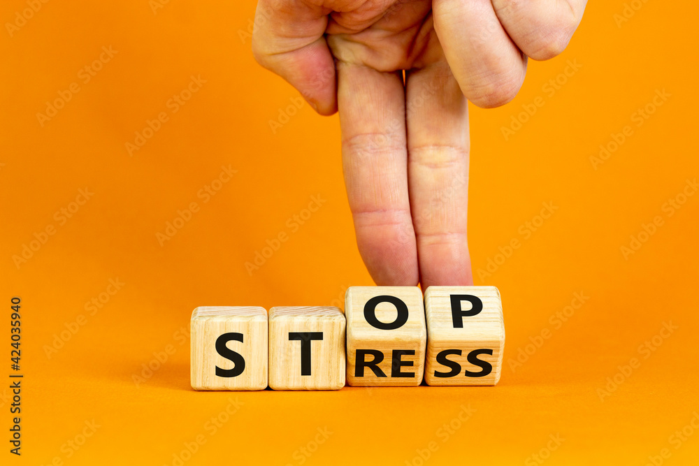 Stop stress and be health symbol. Doctor turns cubes and changes words ...