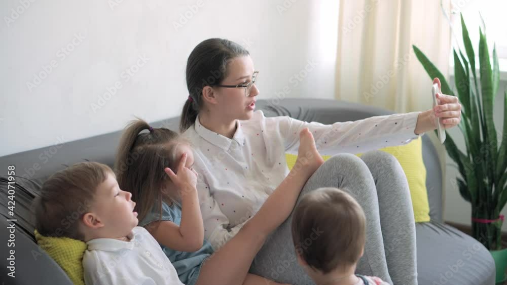 caucasian family little children girl boy and mom talking in video ...