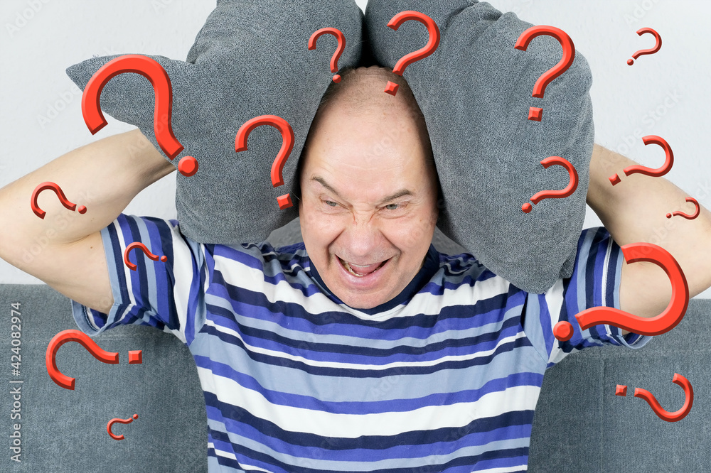 adult man sits on sofa, wrapped head in hands, question marks ...