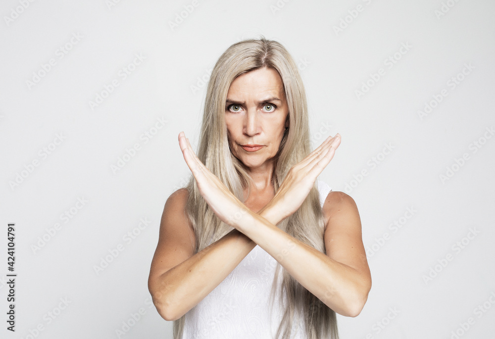 Elderly woman with long gray hair wearing casual style rejection ...