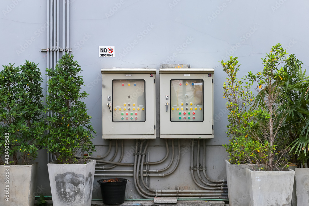 Electric control box in the park There is a no smoking sign next to it ...