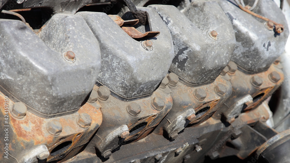 One part four cylinder head with disassembled exhaust manifold of old ...