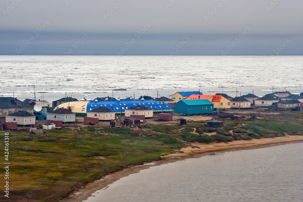 Northern settlement on the shores of the Arctic Ocean. Aerial view of ...