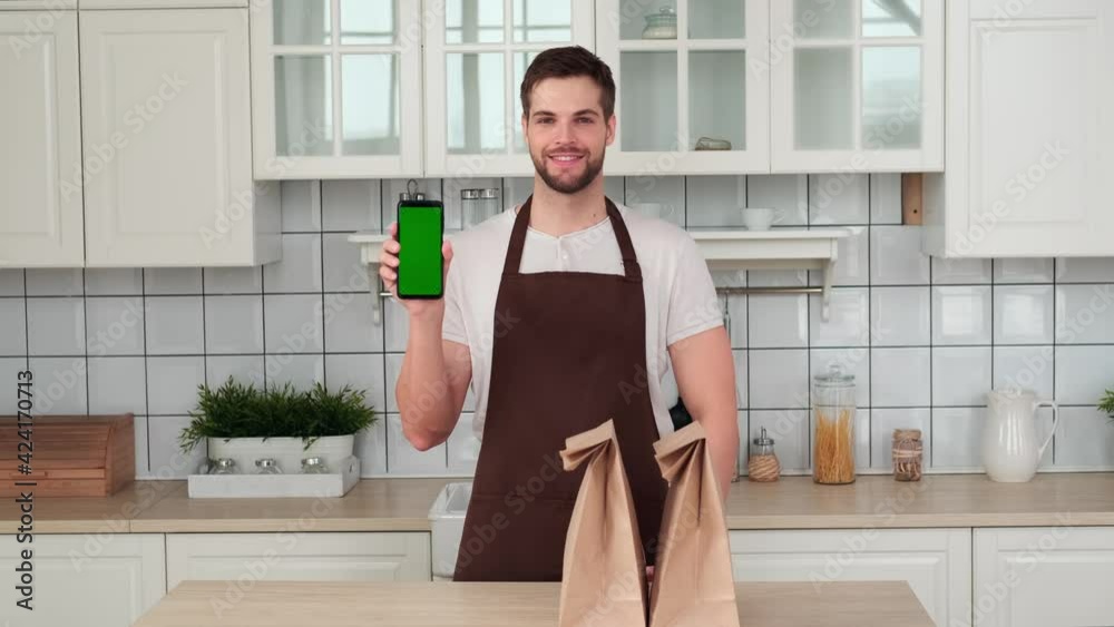 Vegan Cooking, Male Chef, Healthy Eating, Food Delivery. A man holds a ...