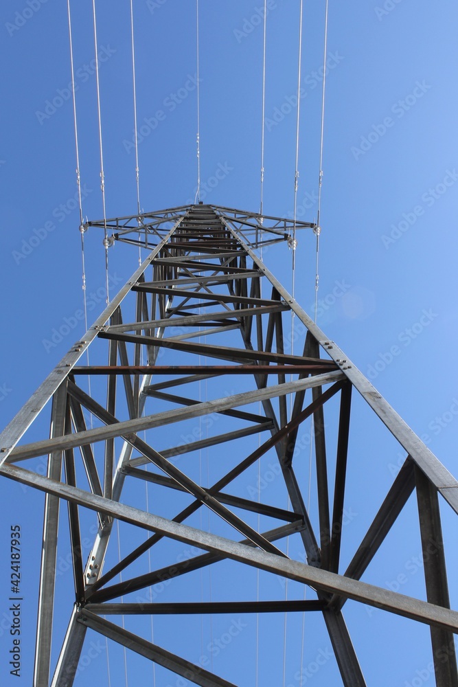 Rising Energy prices. High voltage pylon conductor against clear blue ...