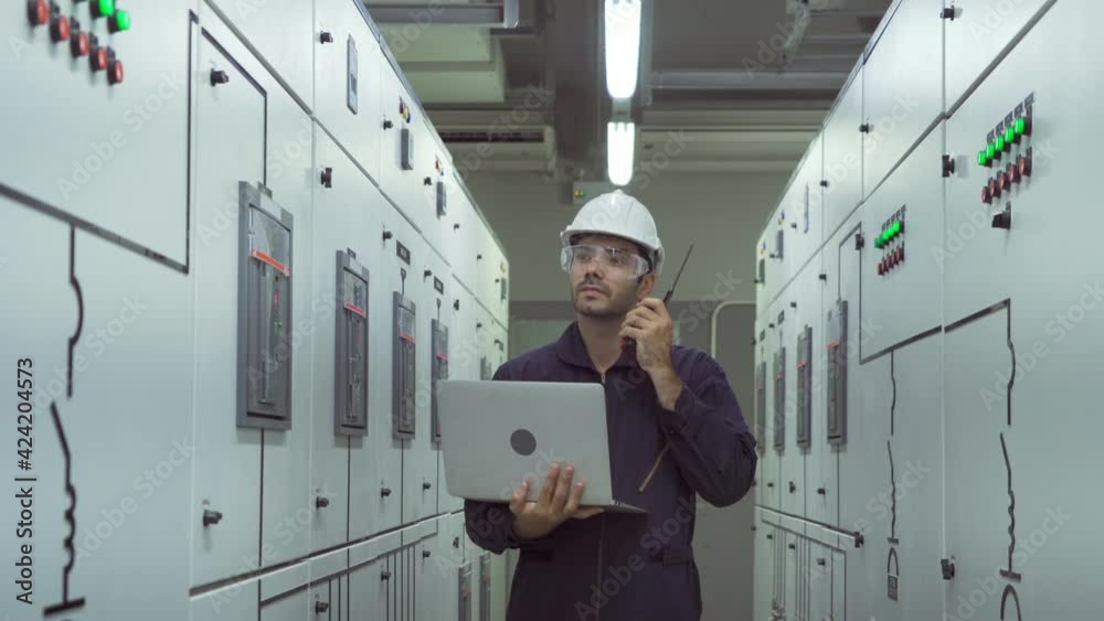 An engineer man or worker, people using a laptop computer, working in ...