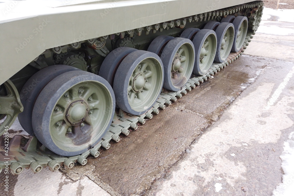 Tank wheels close-up. Iron tracks of a heavy military tank. Iron ...