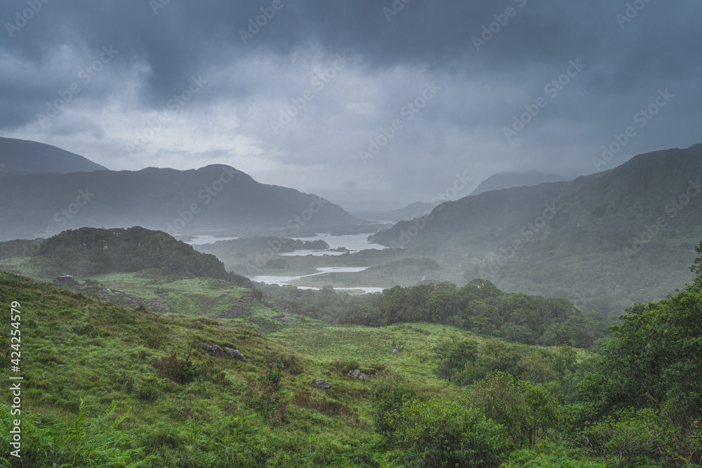Atmospheric, dramatic storm sky and clouds, mist and heavy rain in ...