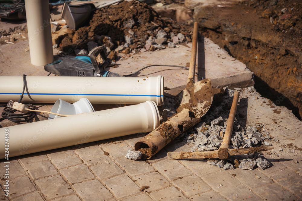 Repair of pipelines in the city. Plastic sewer pipe. Replacing old ...