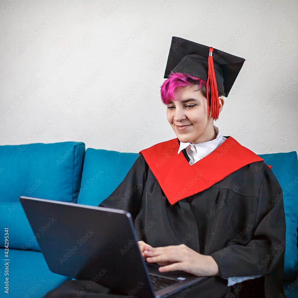 Virtual graduation and convocation ceremony. Excited student wearing ...