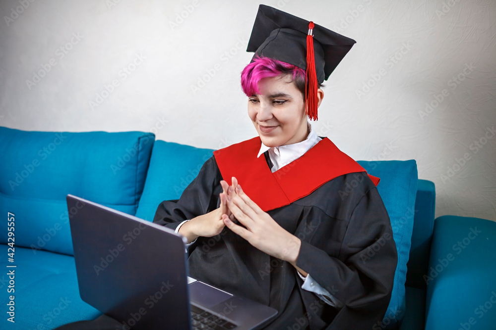 Virtual graduation and convocation ceremony. Excited student wearing ...