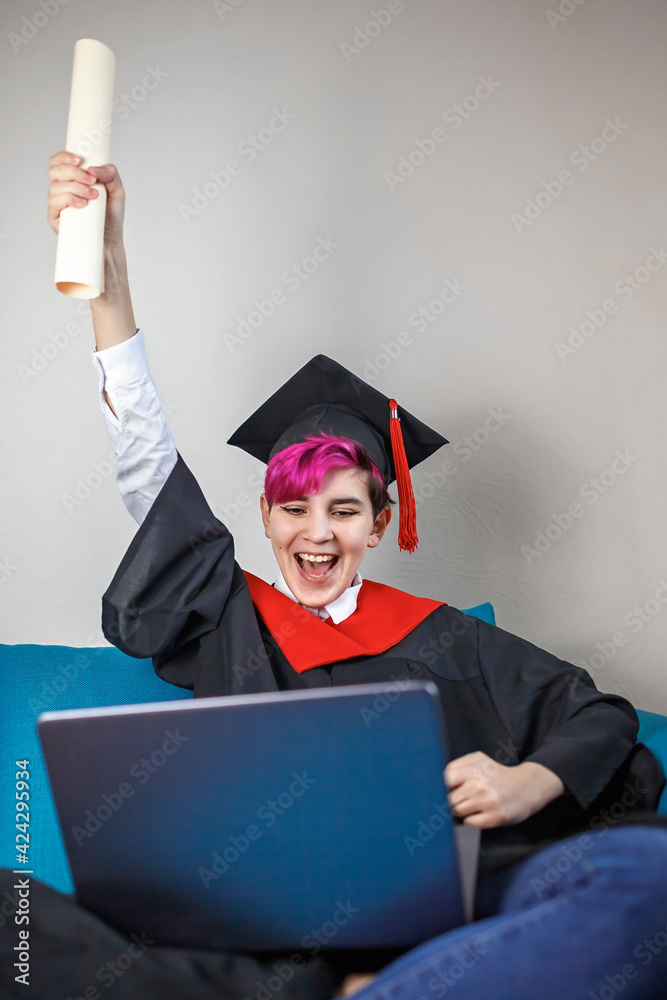 Virtual graduation and convocation ceremony. Excited student wearing ...