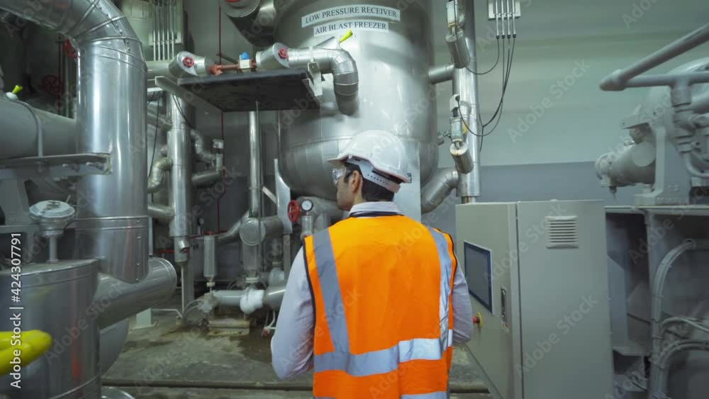 An engineer man or worker, people working in industry factory. Chiller ...